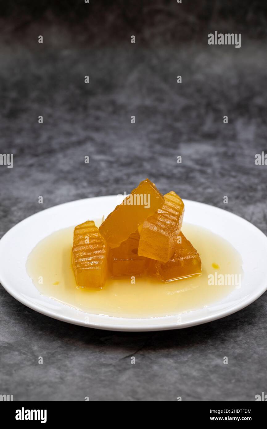 Pumpkin dessert with syrup on dark background. Traditional ...