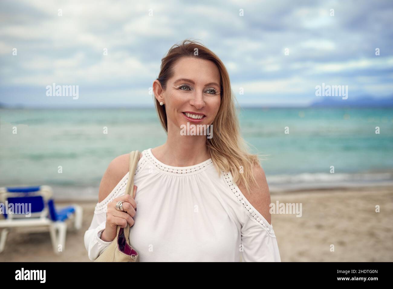 Woman standing deck chair hi-res stock photography and images - Alamy