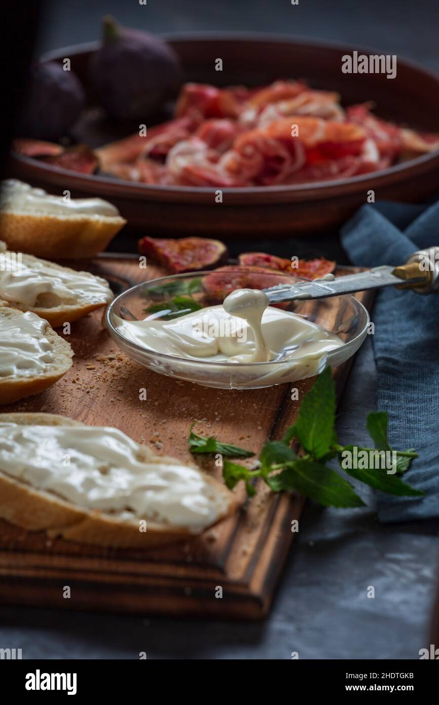 Making ham sandwiches and tapas ingredients, CLOSE UP Stock Photo - Alamy