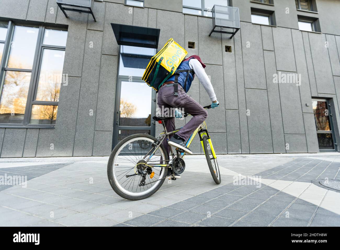 KIEV, UKRAINE - April 28, 2021: Glovo bike courier on the street ...