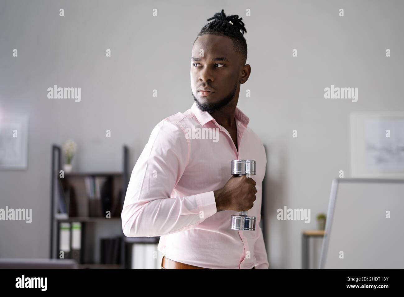 Man At Office Working Out. Workplace Fitness Stock Photo - Alamy