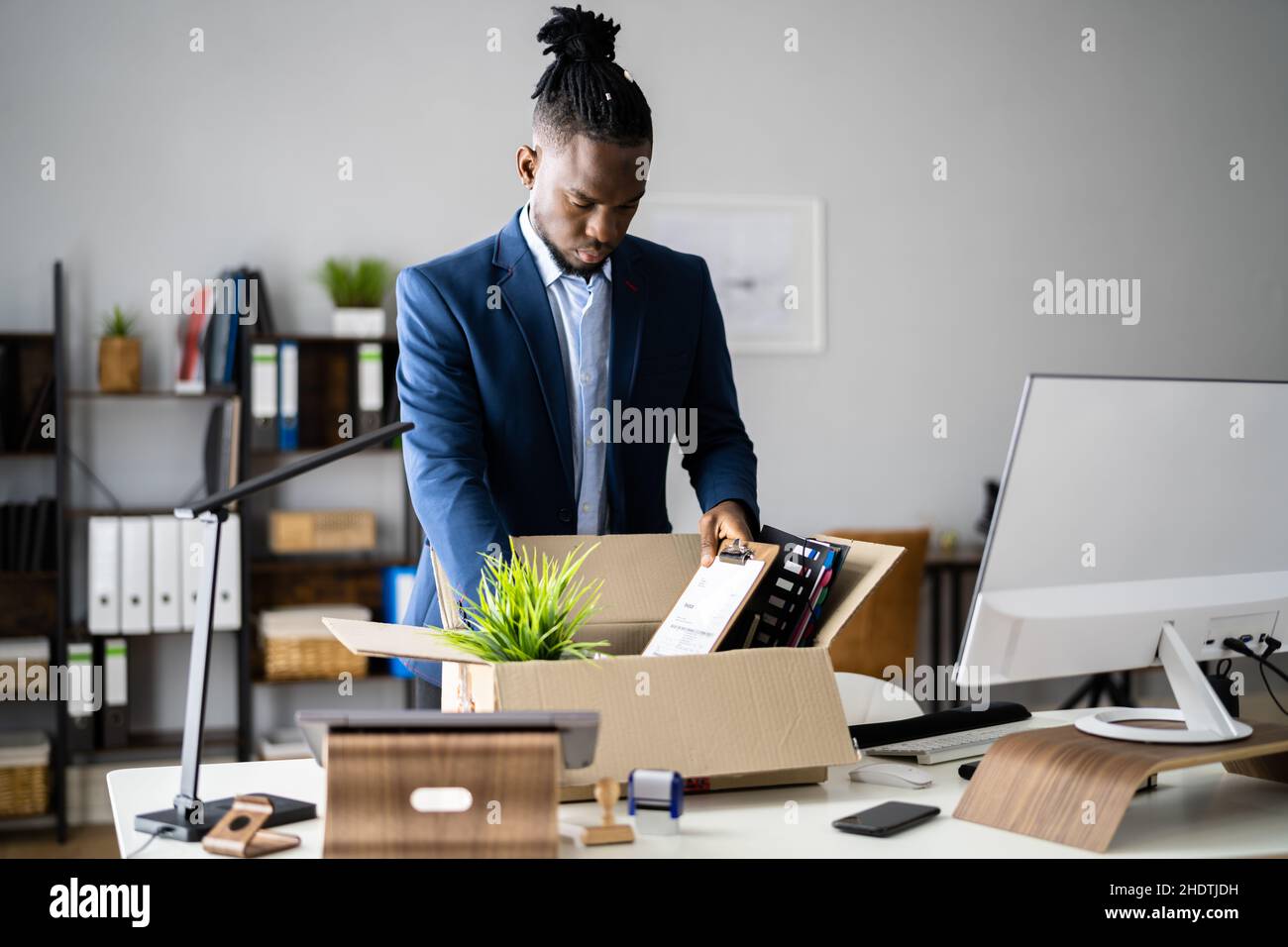 Man holding up a box hi-res stock photography and images - Alamy