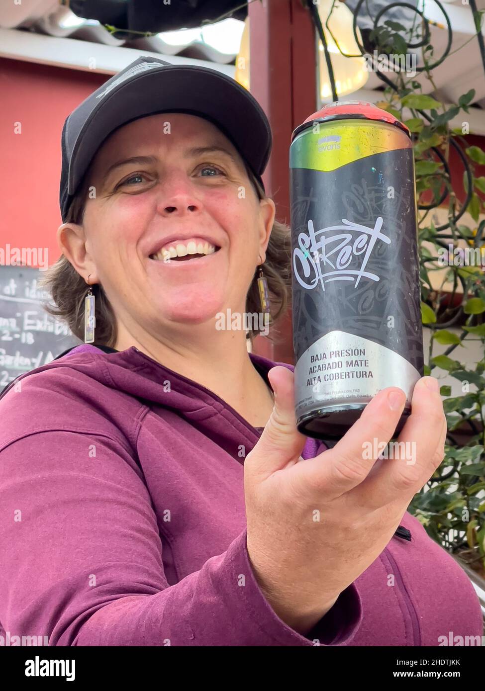 Cuenca, Ecuador, Dec 9, 2021 - woman hold spray can of paint to be used ...