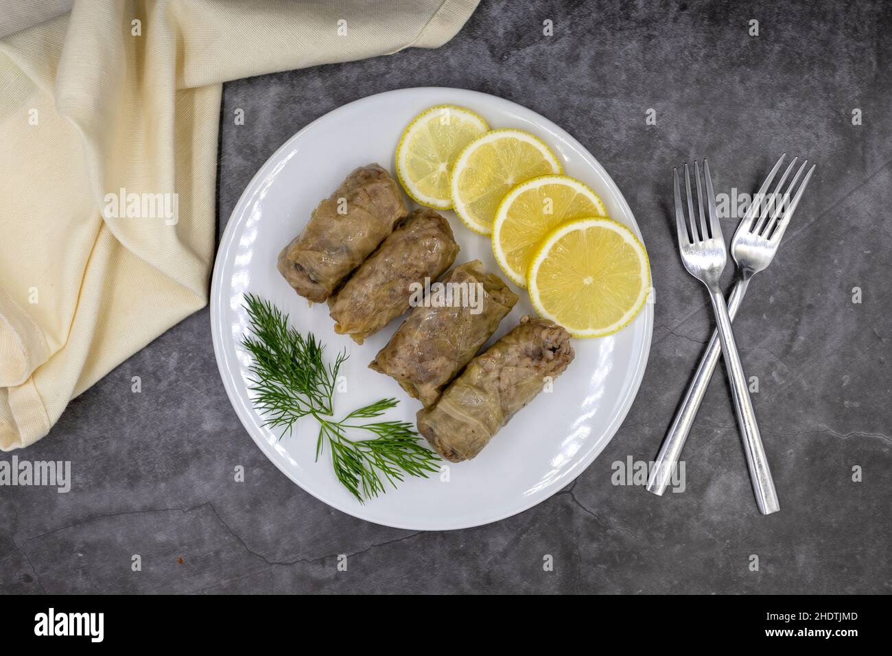 Stuffed cabbage leaves, in a ceramic plate. Vegan cabbage rolls, cooked ...