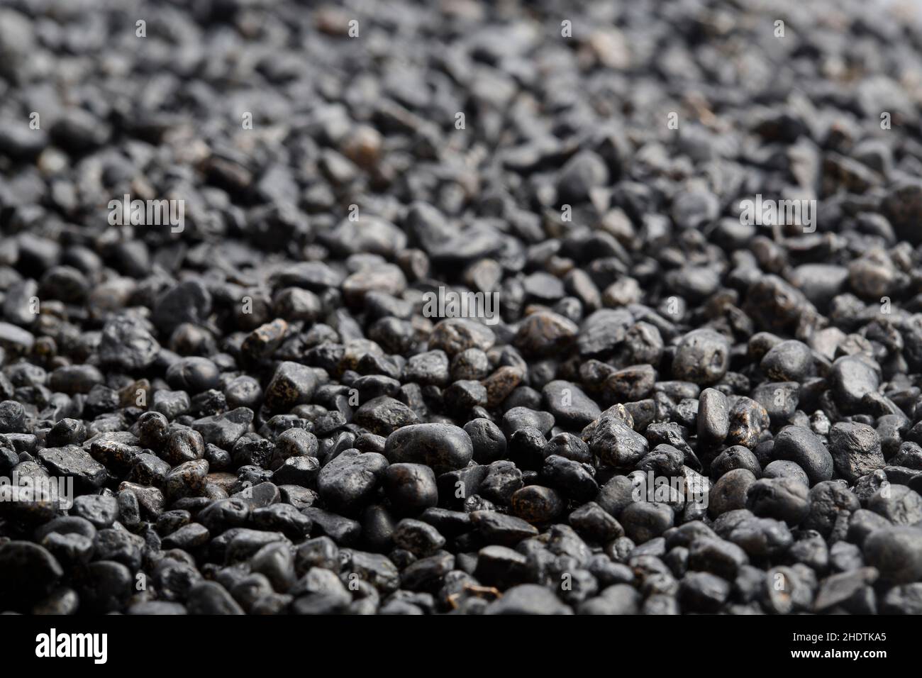 Many dark pebble hi-res stock photography and images - Alamy