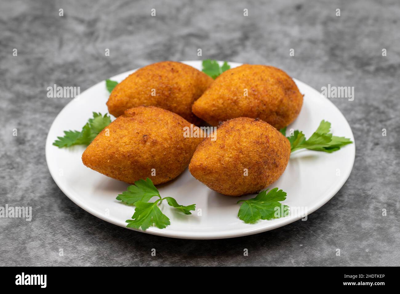 Kibbeh on a dark background. Kibbeh is a popular dish in Middle Eastern ...