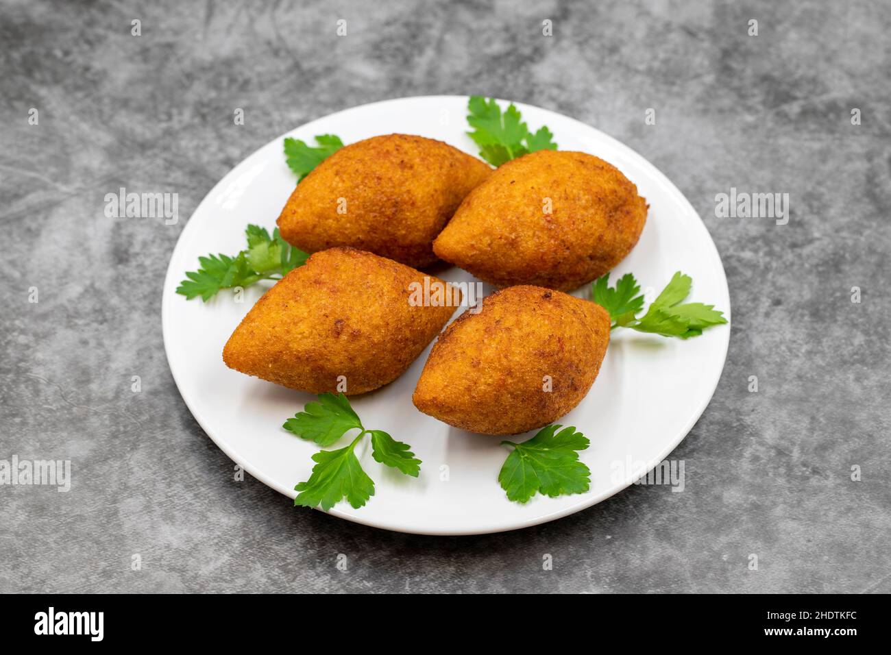 Kibbeh on a dark background. Kibbeh is a popular dish in Middle Eastern ...