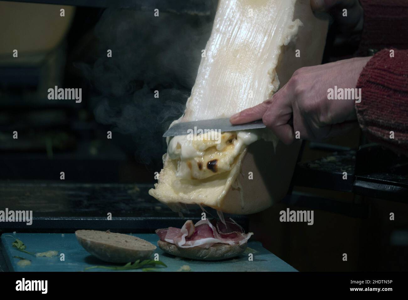 Raclette panini melted swiss cheese sandwich Stock Photo - Alamy