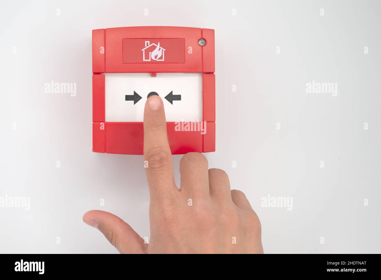 Hand presses fire alarm button Stock Photo - Alamy