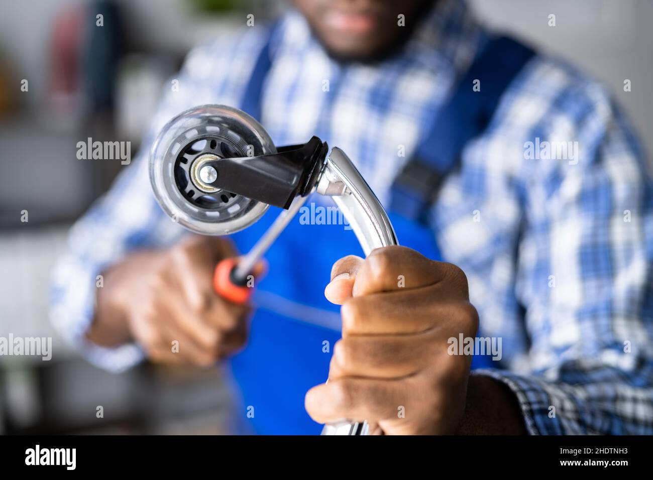 Office Chair Assembling And Repair. Man Working With Tool Stock Photo ...