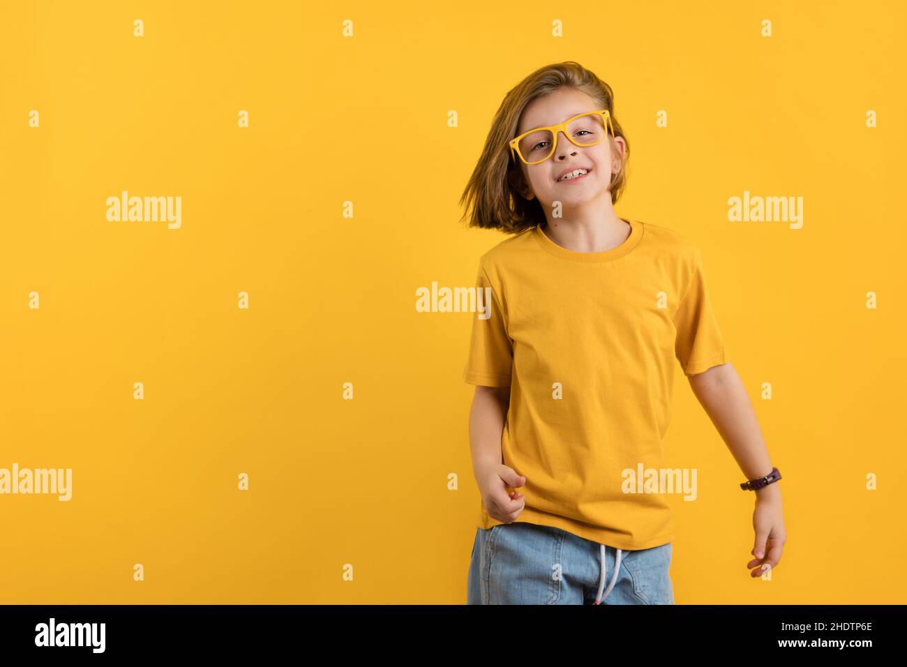 Joyful Little Kid Girl 8-10 Years Old in Yellow T-shirt and Eyeglasses ...