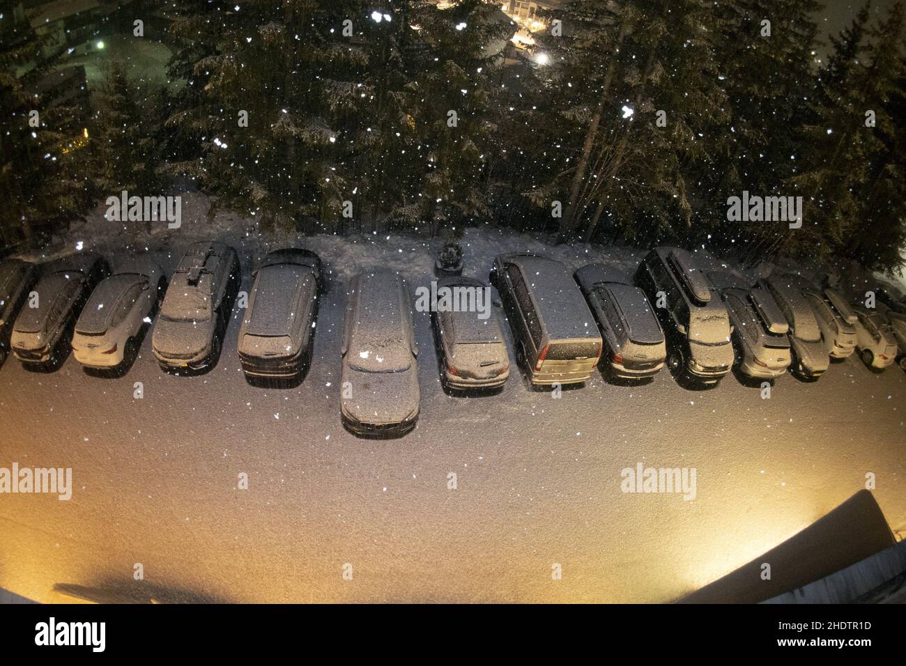 snow falling snowing at night in dolomites mountains car park Stock ...