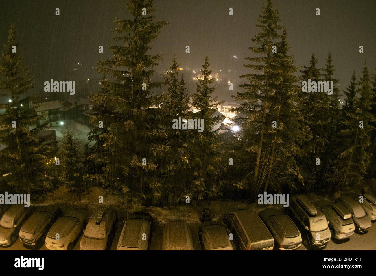 snow falling snowing at night in dolomites mountains car park Stock ...