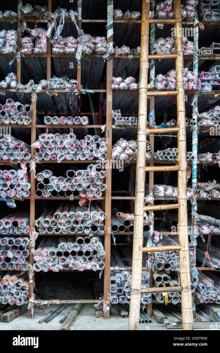 Shelves of steel pipes and stainless steel pipes in the building ...