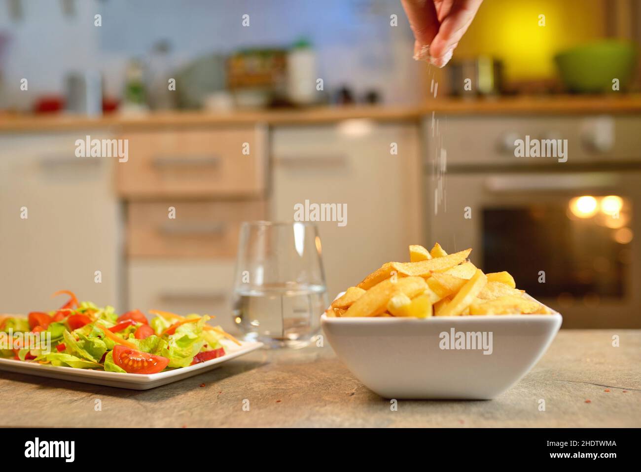 french fries, salting, pommes Stock Photo - Alamy