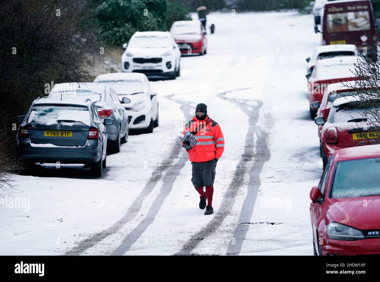 A postman makes deliveries after fresh snow fall in Penistone, Barnsley ...