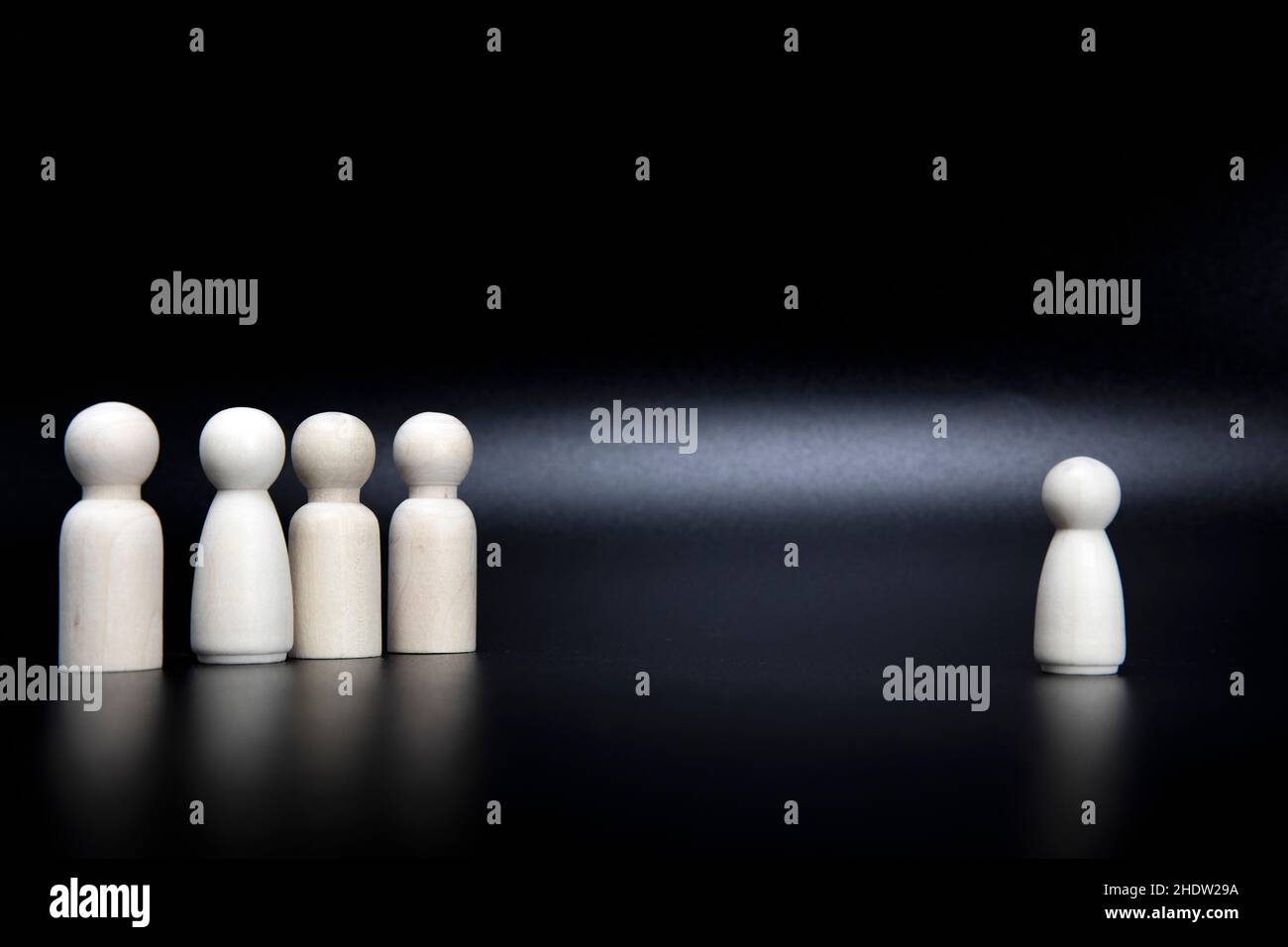 One child figure standing outside the group being excluded. Concept ...