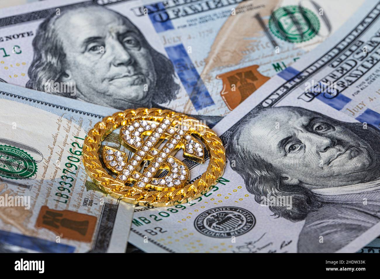 golden dollar sign with gemstones on 100 dollar banknote background for ...