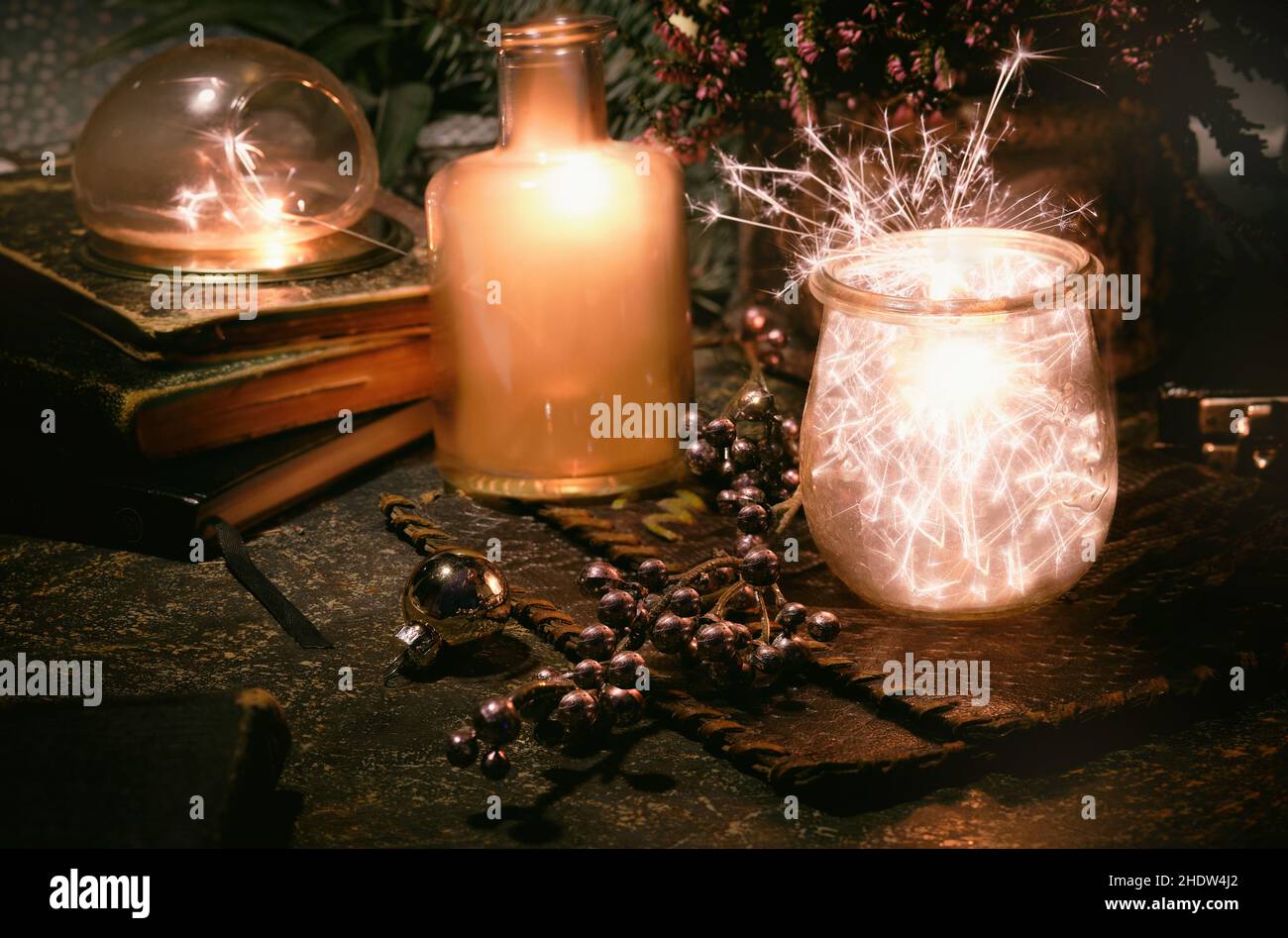 Magic lights with sparkles and orange glow in vintage glass jars ...