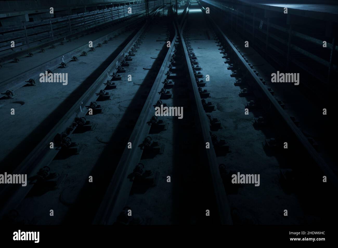 Underground facility with a big tunnel leading deep down. Metro ...