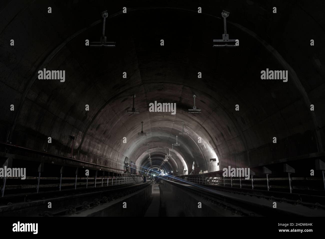 Underground facility with a big tunnel leading deep down. Metro ...