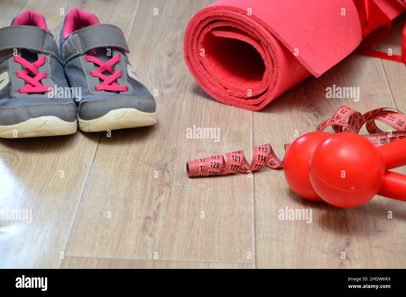 still life of group sports equipment for womens and cardiogram of jump rope. Fitness and healthy ...