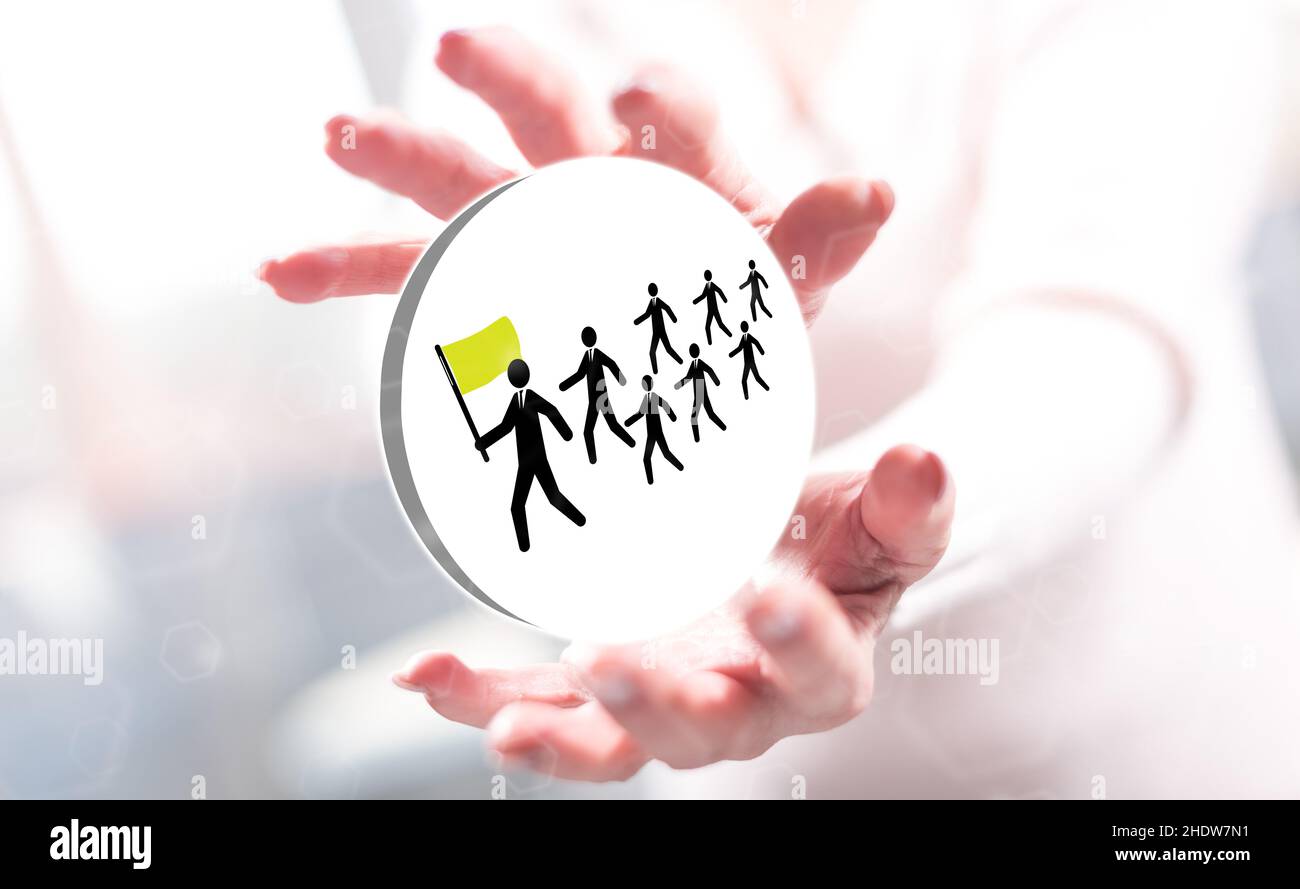 Leadership concept between hands of a woman in background Stock Photo ...
