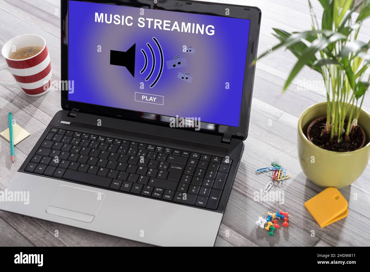 Laptop on a desk with music streaming concept on the screen Stock Photo ...