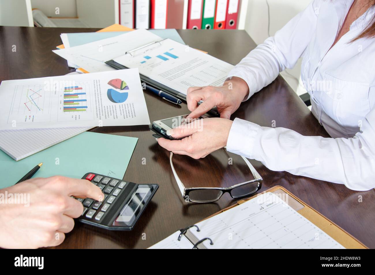 Two business people working together Stock Photo - Alamy