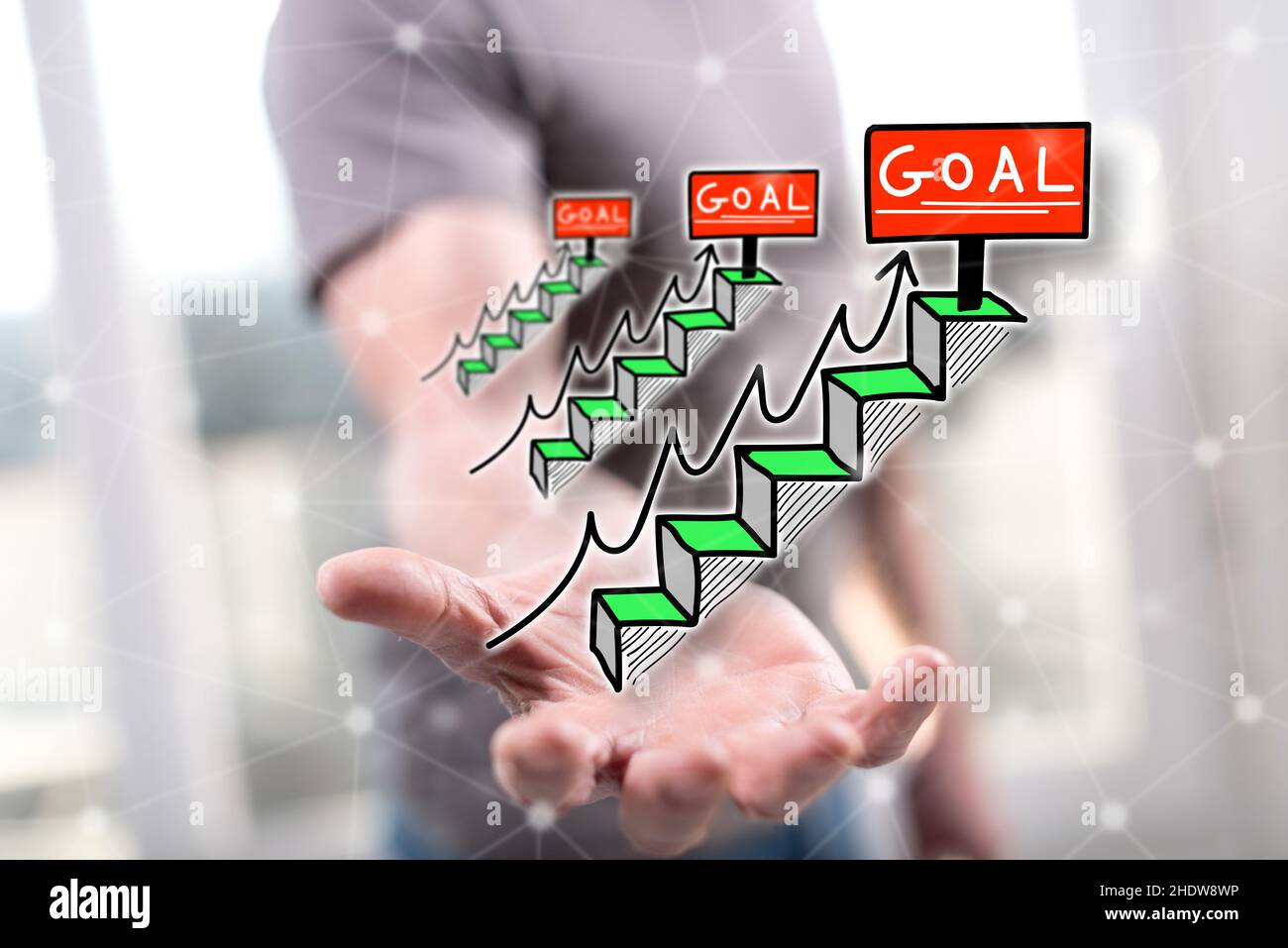Goal concept above the hand of a man in background Stock Photo - Alamy