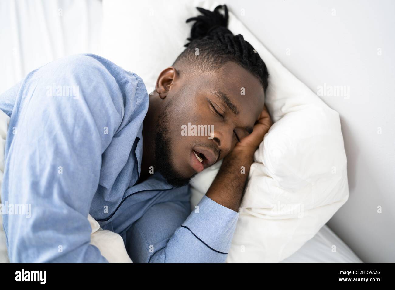 African American Man With Sleep Apnea Snoring Stock Photo - Alamy