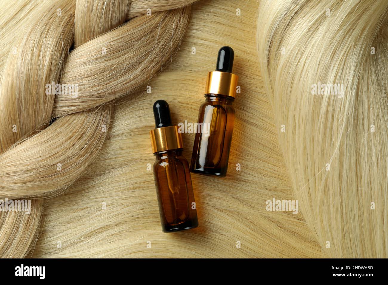 Concept of hair care with bottles of cosmetic and female hair Stock ...