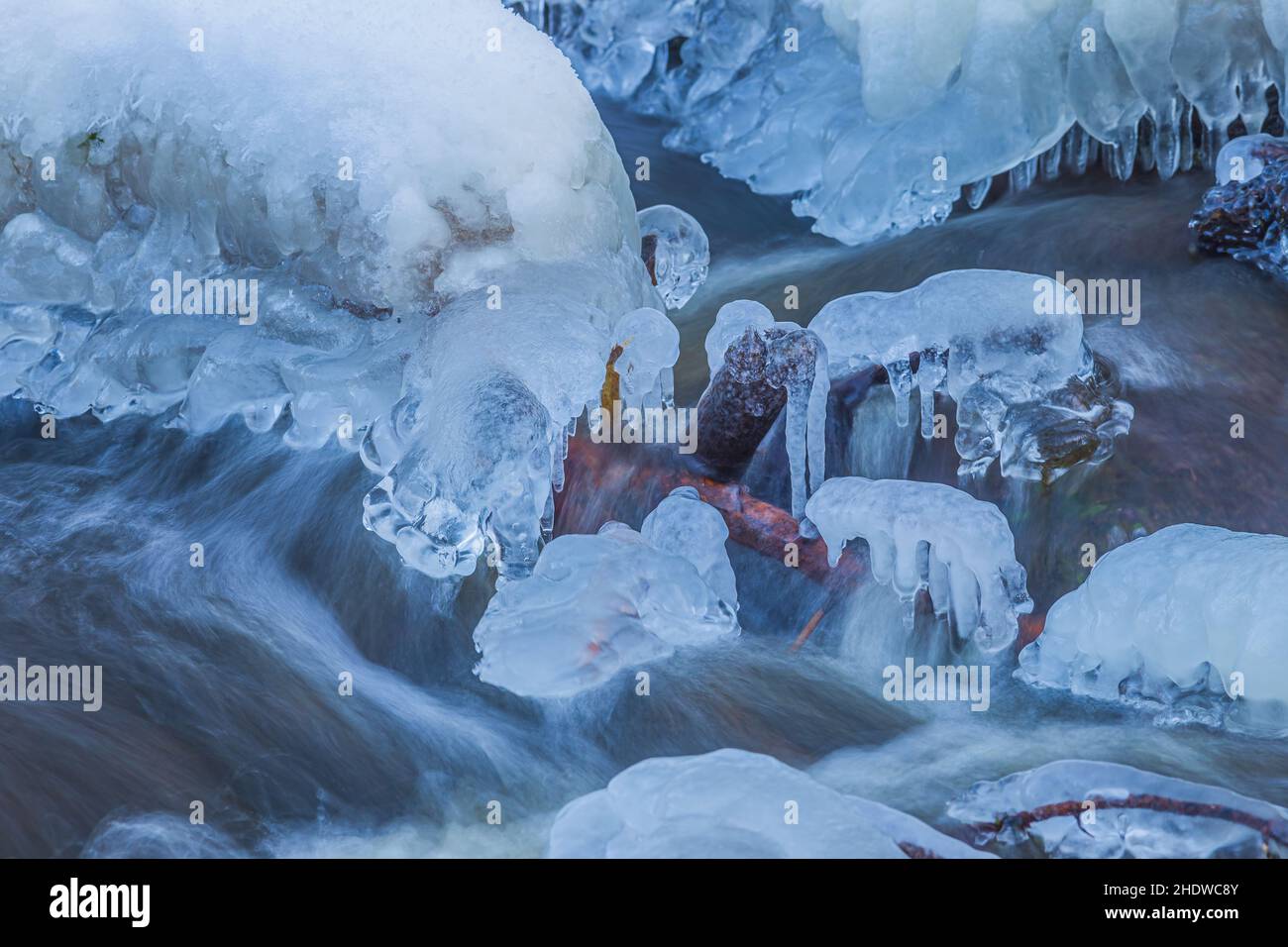 Icicles at winter, cold weather with icicles over river stream ...