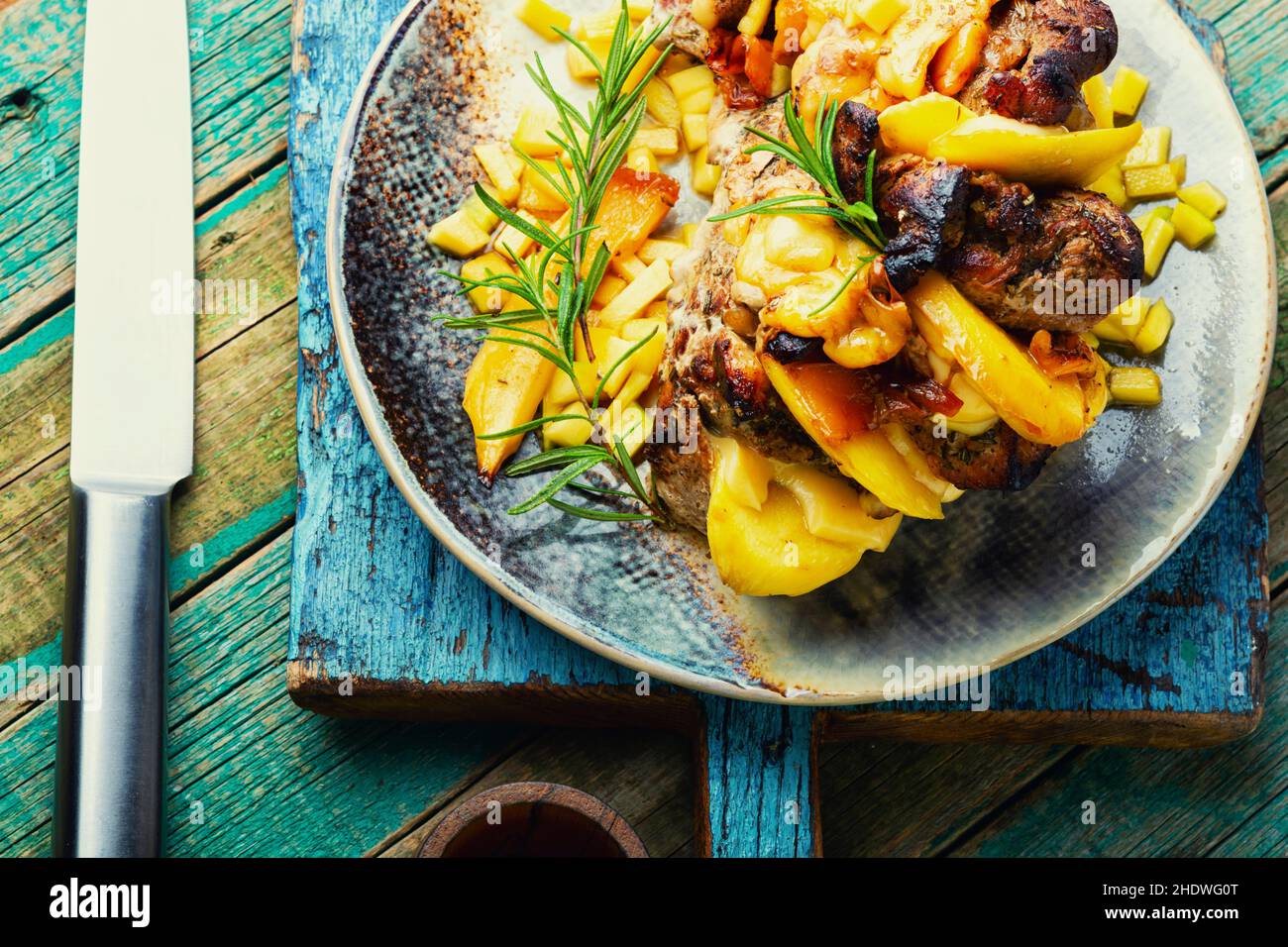 Delicious grilled meat with mango and cheese Stock Photo - Alamy