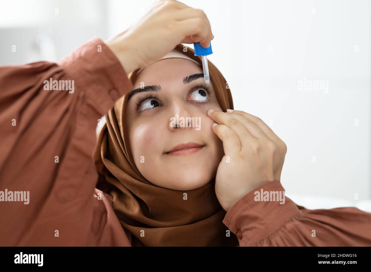 Woman Pouring Eye Drop Medication For Glaucoma And Conjunctivitis Stock ...