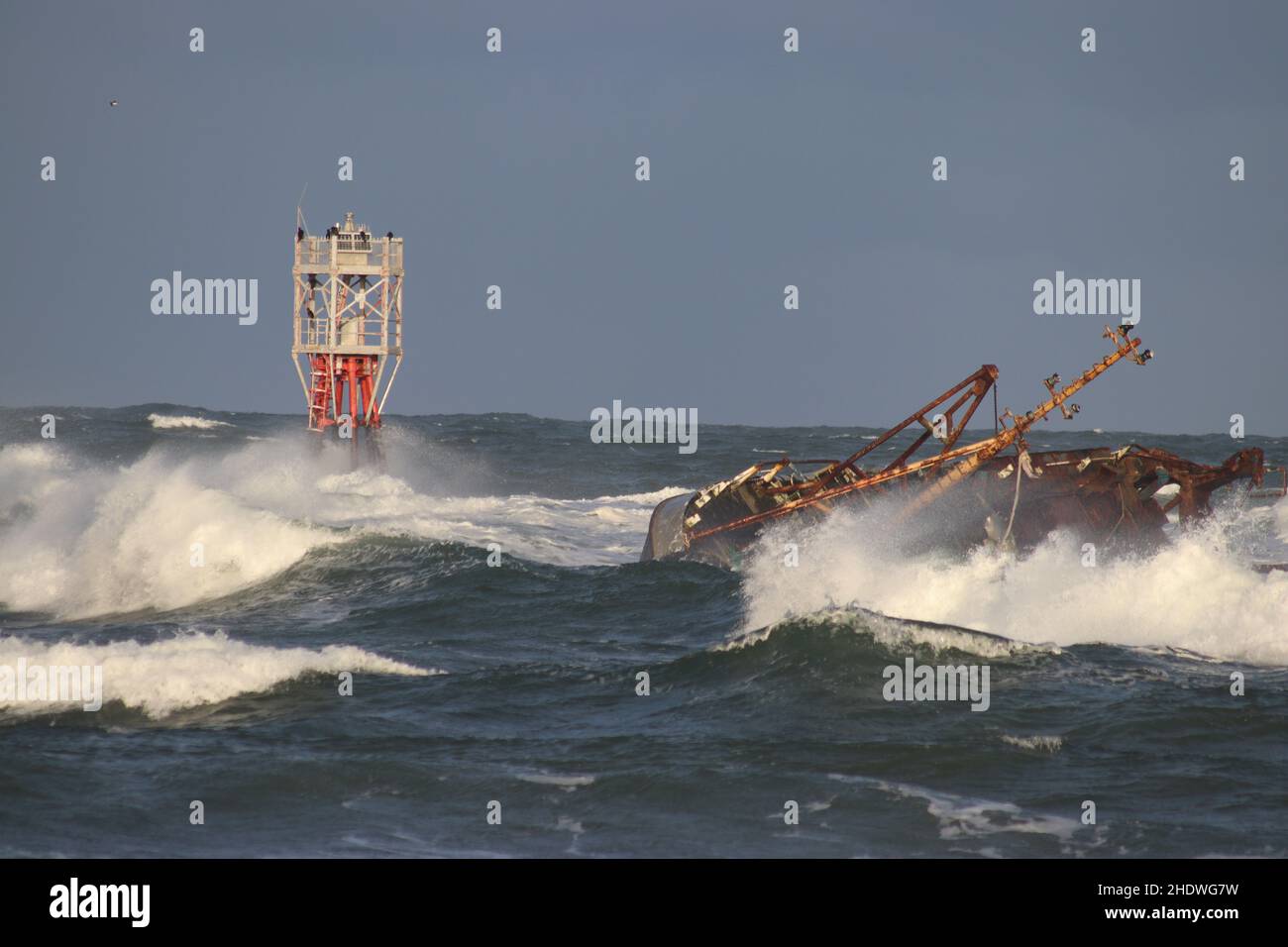 Shipwreck and warning beacon Stock Photo - Alamy
