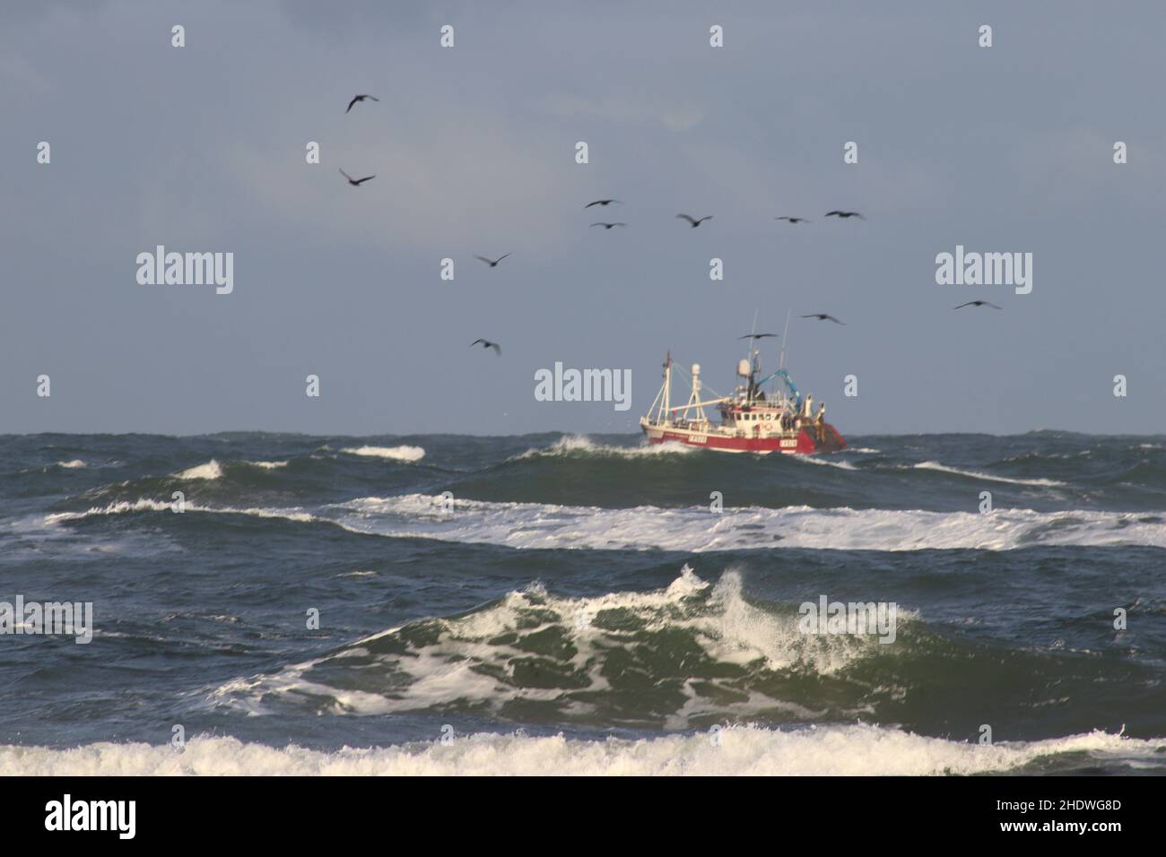 Red fishing boat Stock Photo - Alamy