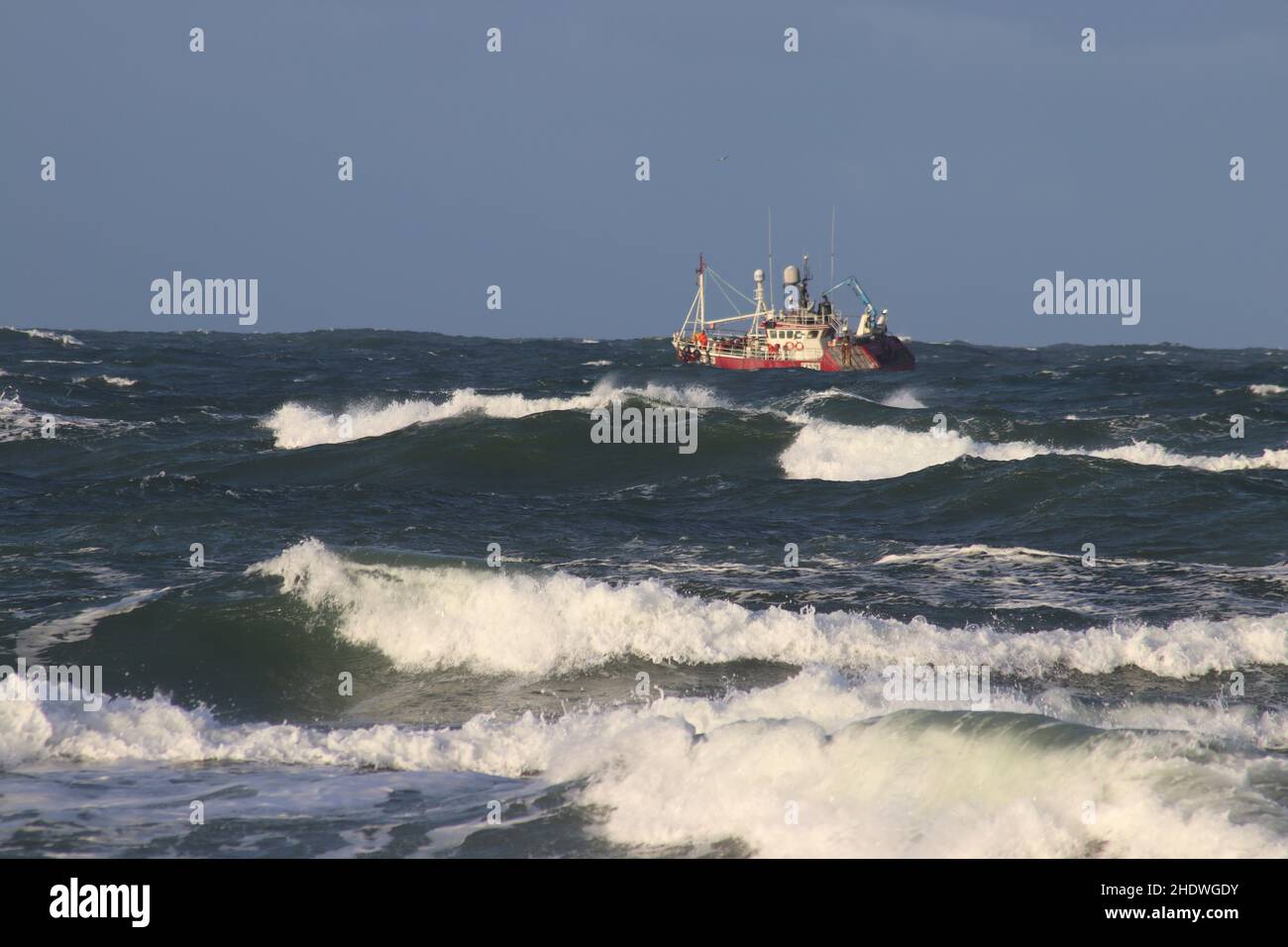 Red fishing boat Stock Photo - Alamy