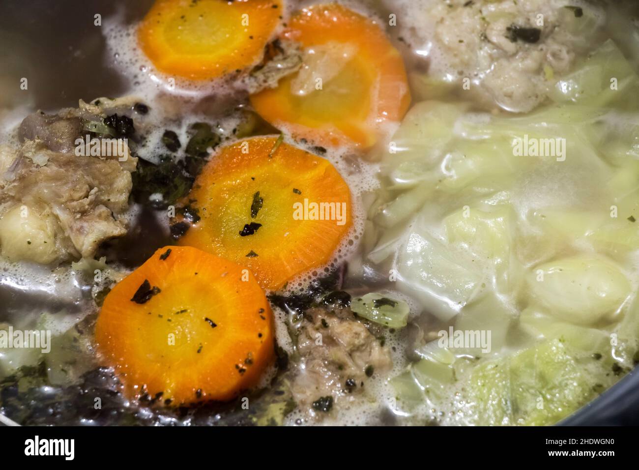 The soup is cooked on the stove during cooking in a large saucepan ...