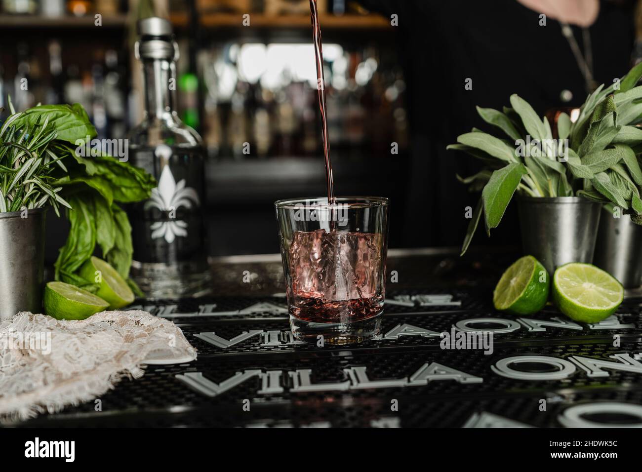 Closeup of a bartender making a high-end craft cocktail Stock Photo - Alamy