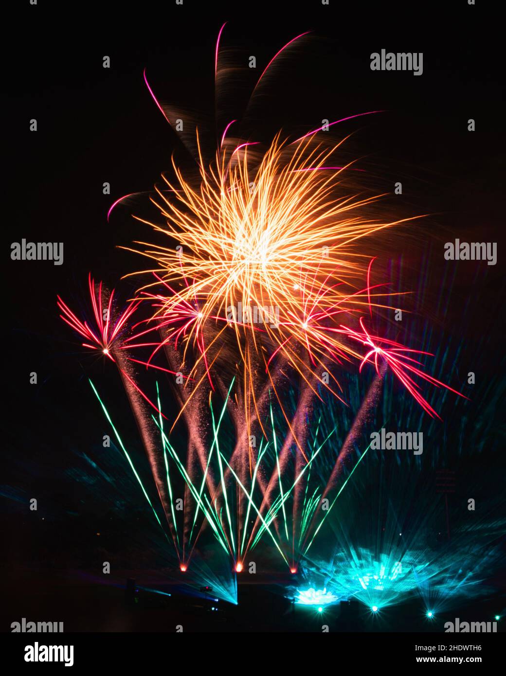 Vertical shot of fireworks during the night Stock Photo - Alamy
