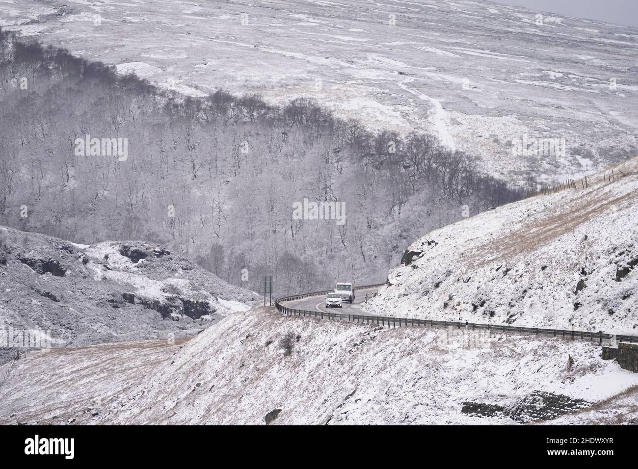 Vehicles navigate fresh snow fall on A628 at Woodhead pass. Picture ...