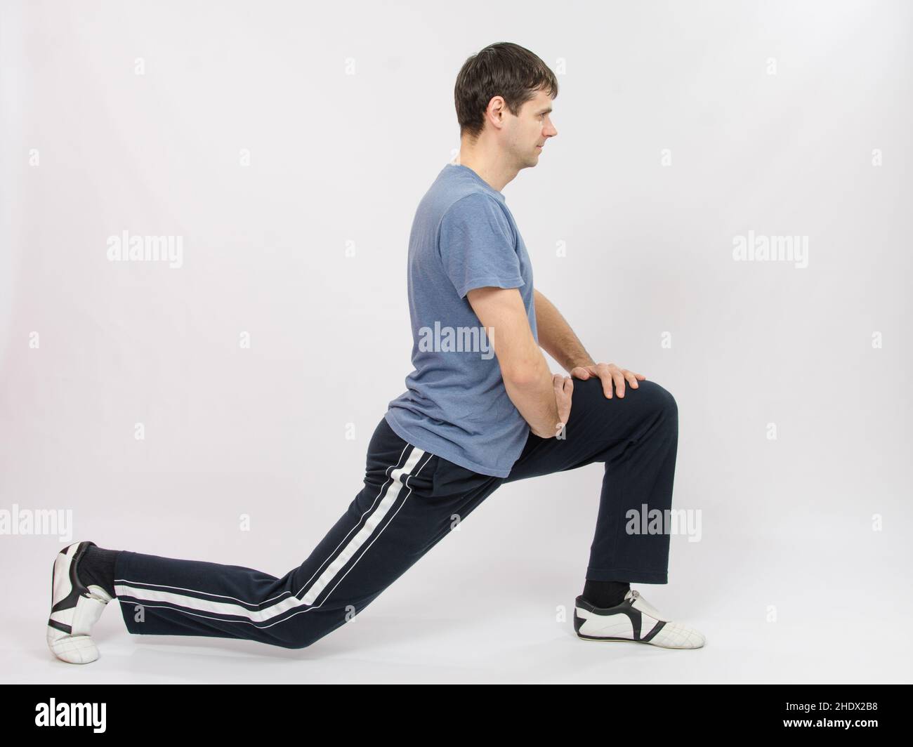 Young fitness man stretching hi-res stock photography and images - Alamy