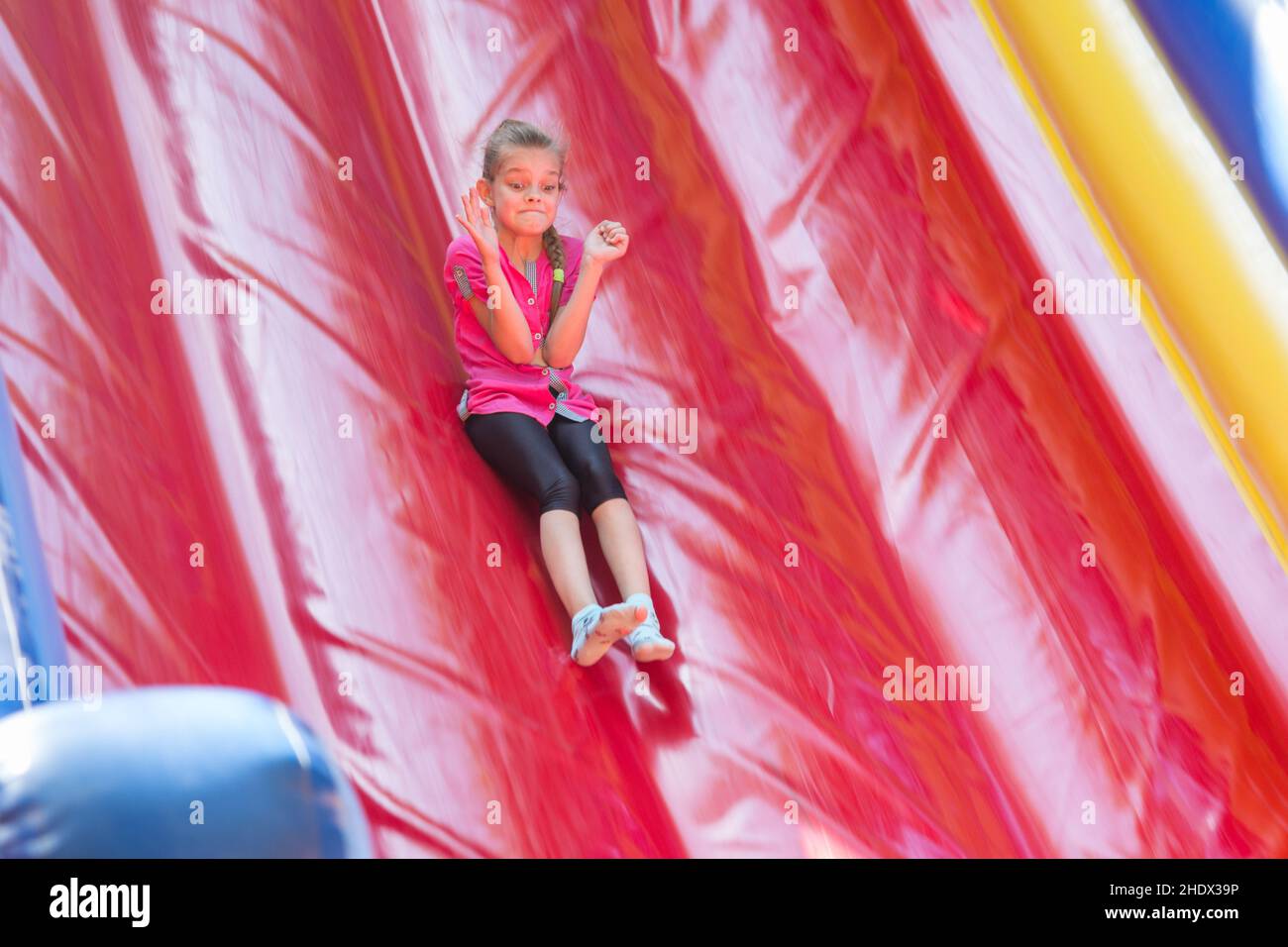 Kids sliding bouncy hi-res stock photography and images - Alamy