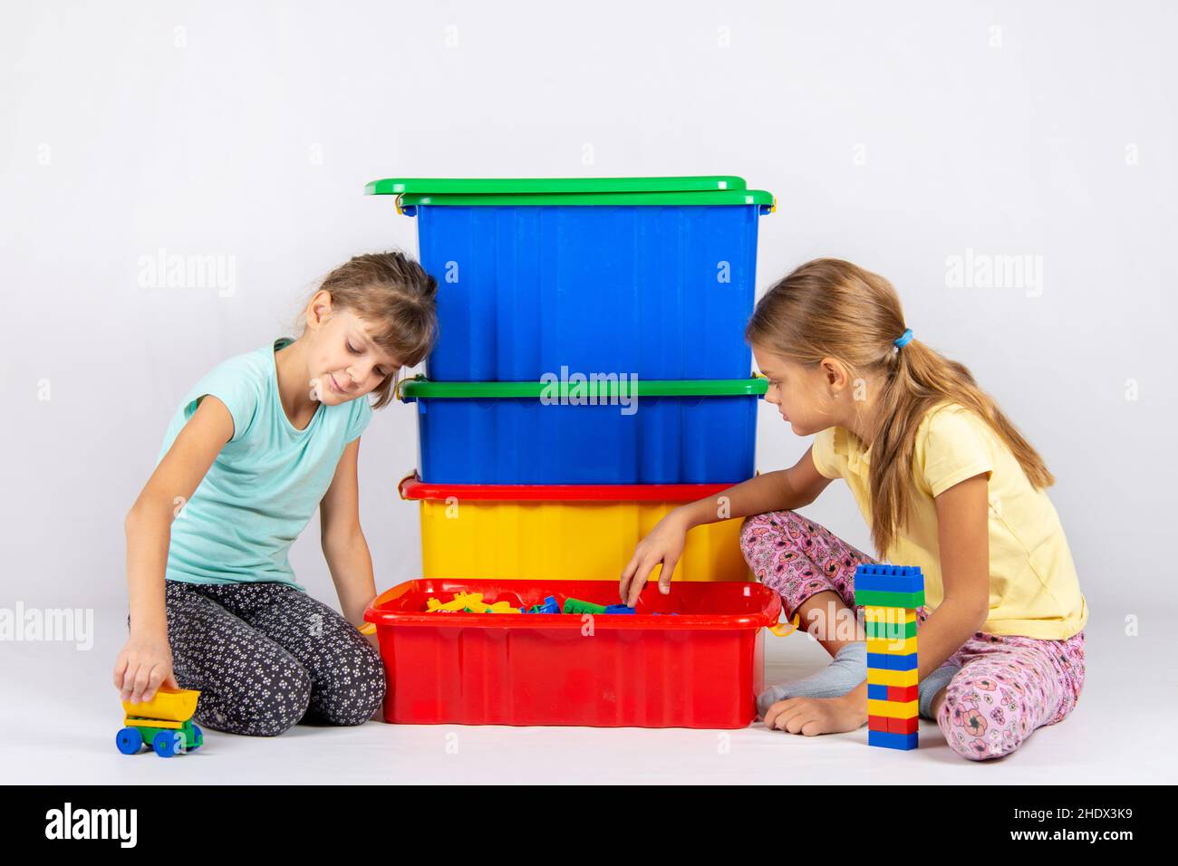 Children playing plastic box hi-res stock photography and images - Alamy