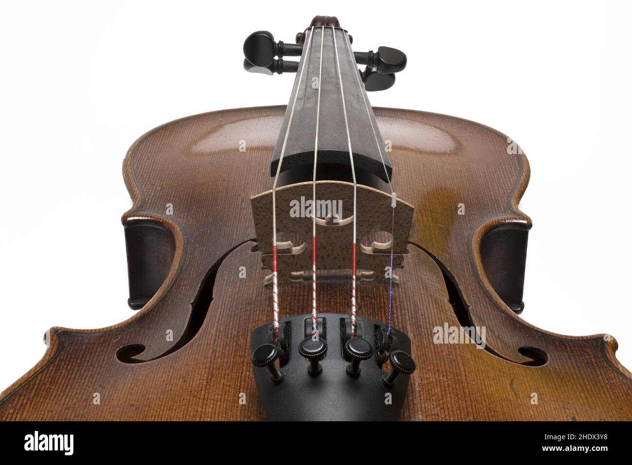 Close-up of the sound body and strings of an old violin seen from ...