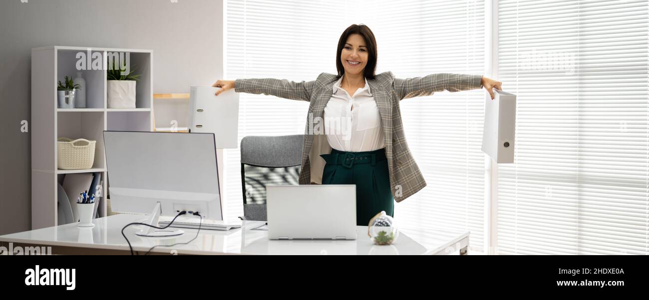 Exercise Workout In Corporate Office With Documents Stock Photo - Alamy