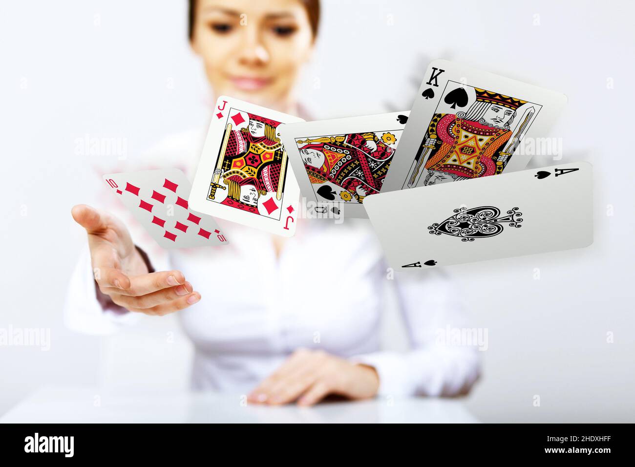 Female throwing cards hi-res stock photography and images - Alamy
