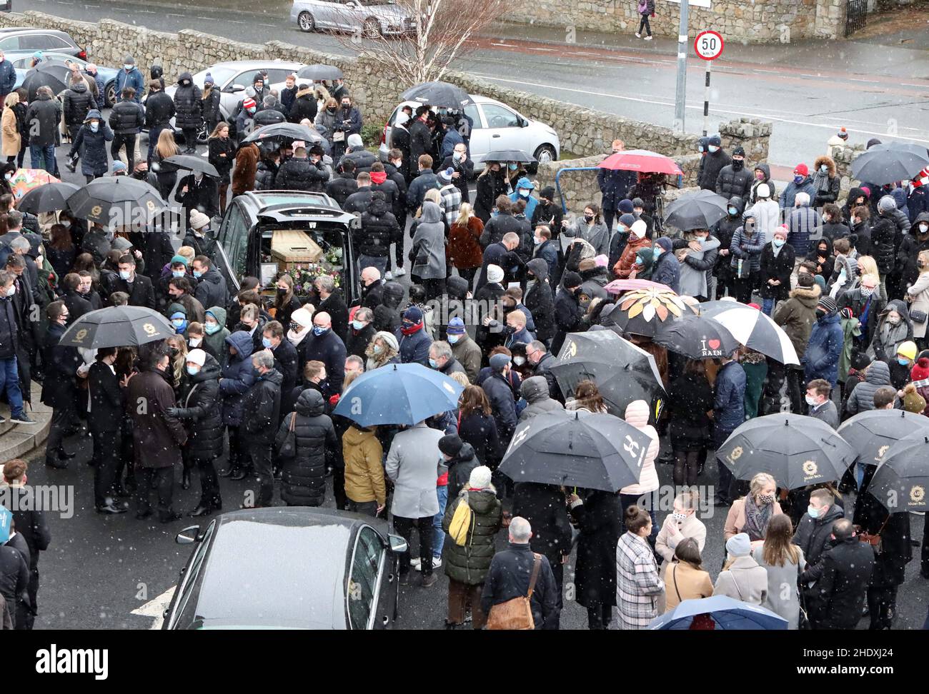 Aoife Beary's coffin is brought out of the church and put into a hearse ...