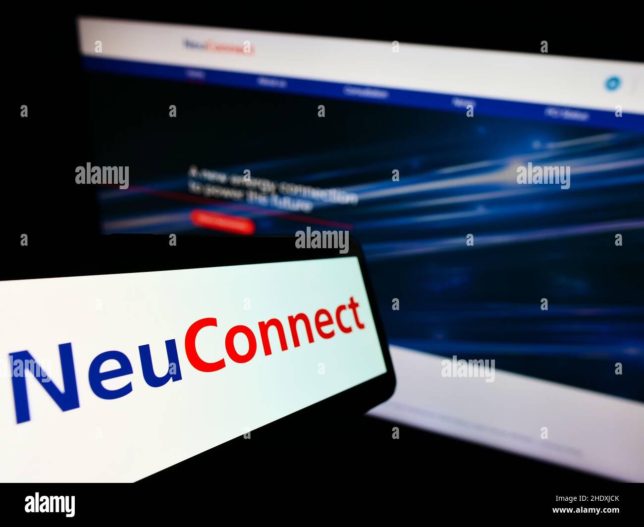 Mobile phone with logo of power transmission project NeuConnect ...